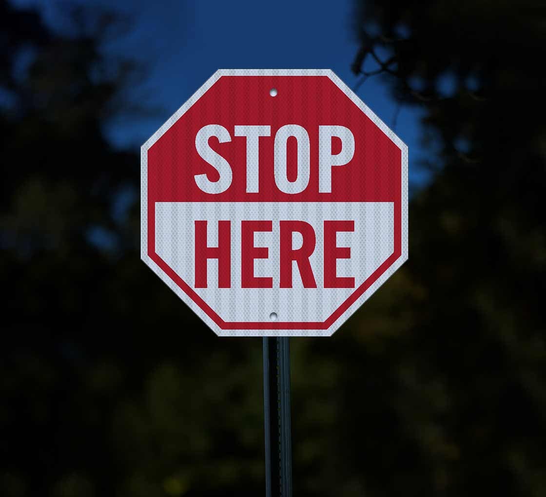 stop here on red traffic sign
